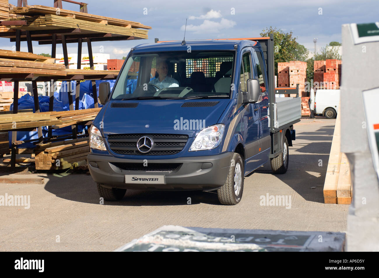 blue mercedes benz sprinter side loader van in builders merchants yard ...