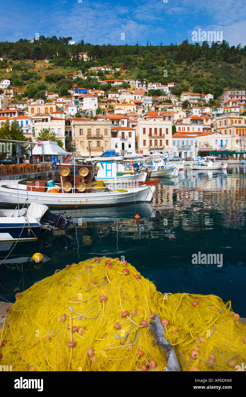 Pastel colored buildings on the waterfront and colorful fishing boats ...