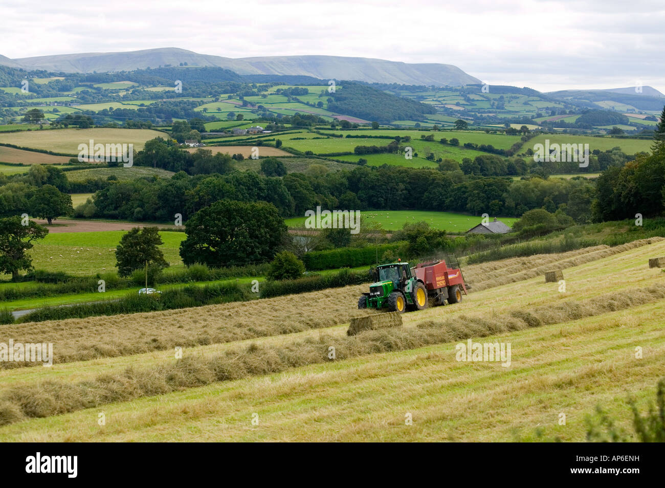 square baler at work in a radnorshire field Stock Photo - Alamy