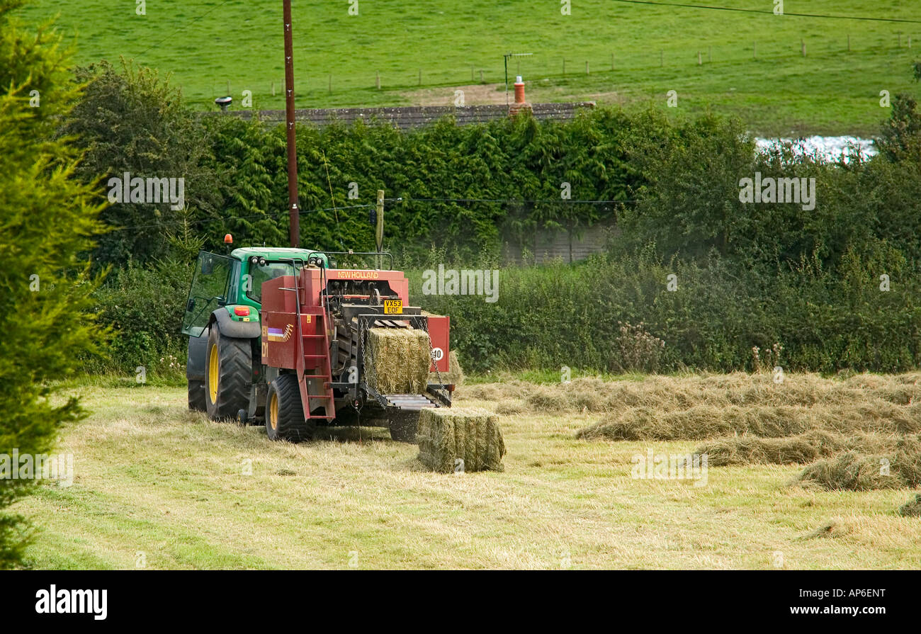 square baler at work in a radnorshire field Stock Photo - Alamy