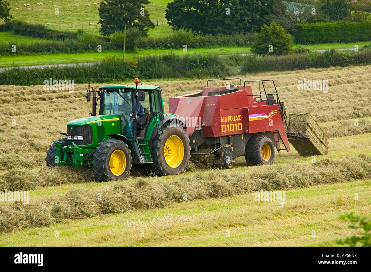 square baler at work in a radnorshire field Stock Photo - Alamy