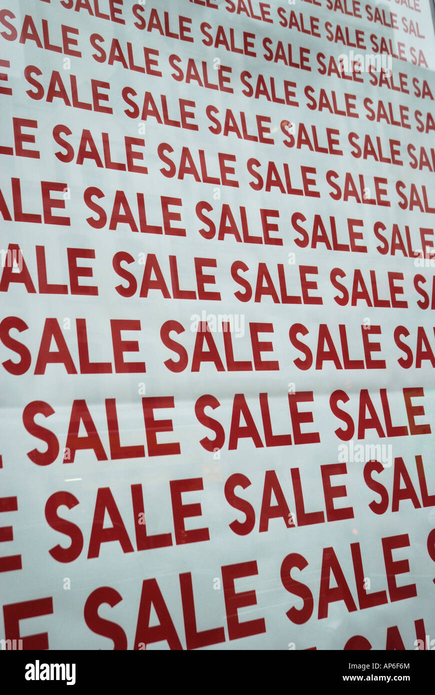 Sale signs in shop window Stock Photo - Alamy