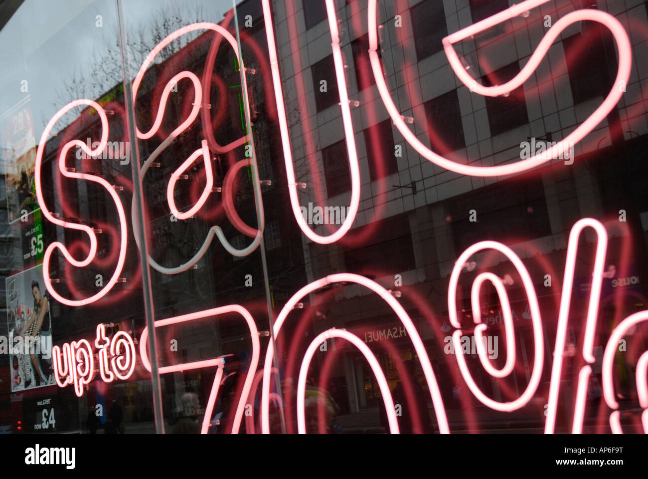Neon sale sign in shop window Stock Photo - Alamy
