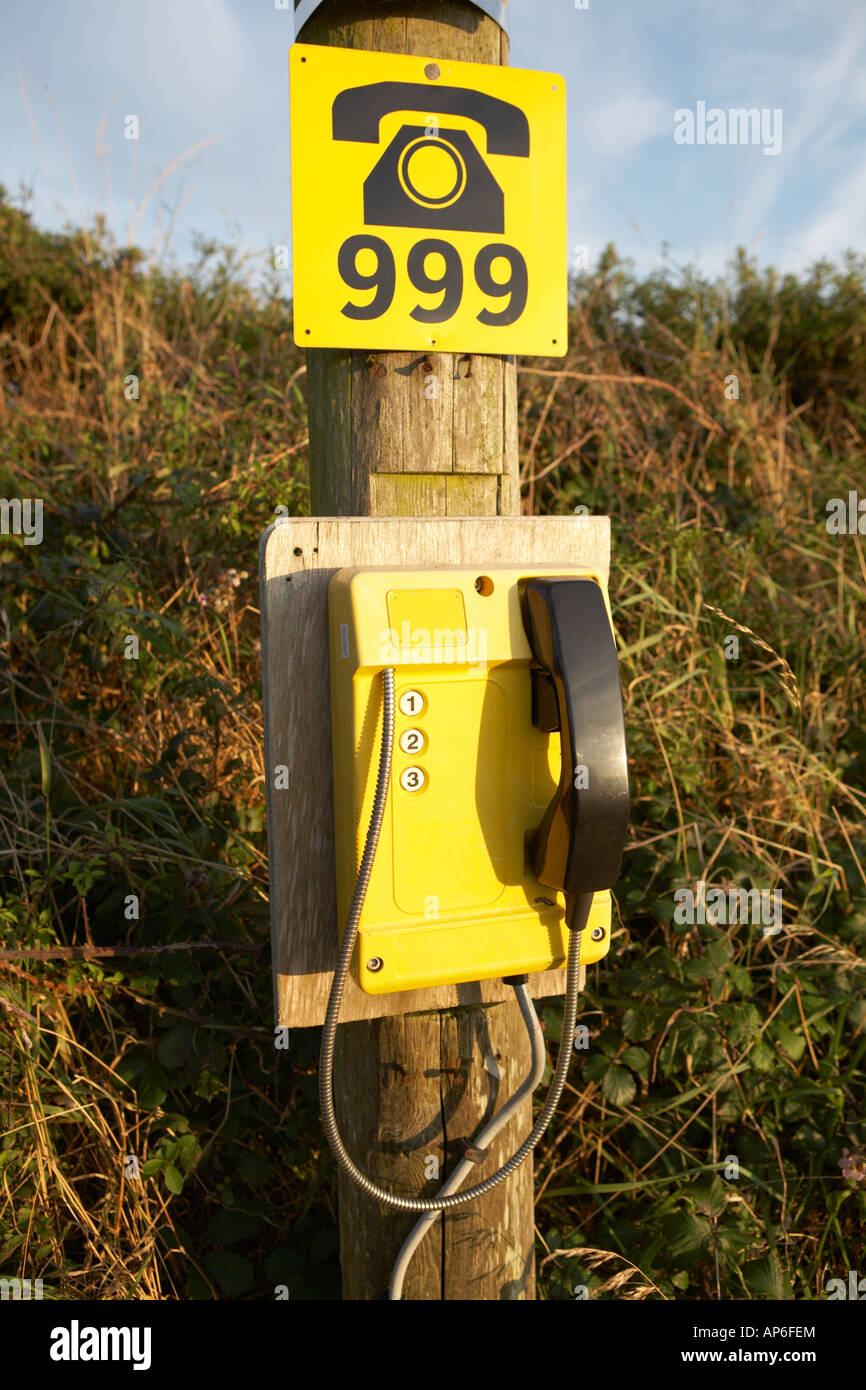 A bright yellow emergency phone Stock Photo - Alamy