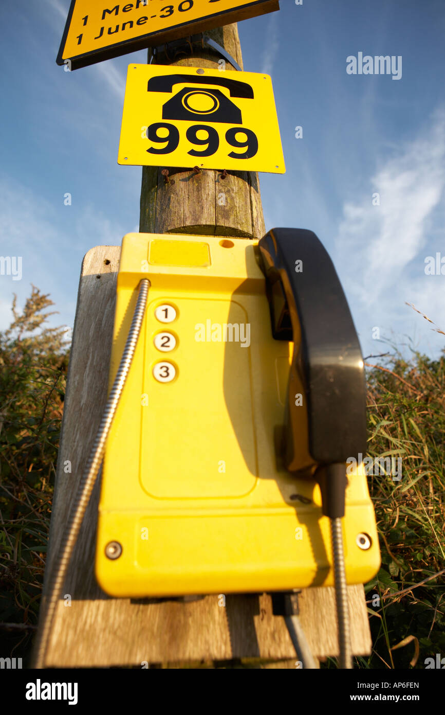 A bright yellow emergency phone Stock Photo - Alamy