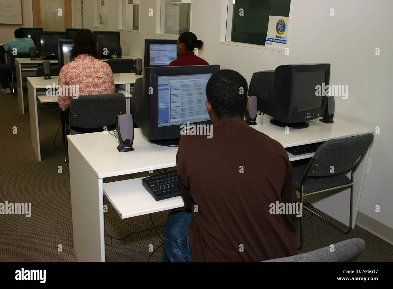 African american girl and boy and caucasian girl using computers Stock ...