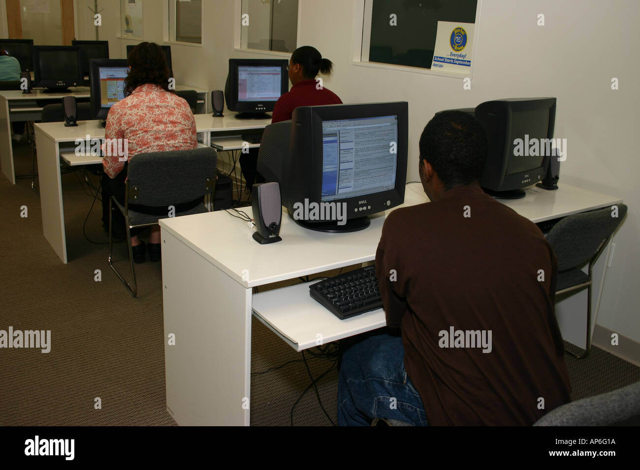 African american girl and boy and caucasian girl using computers Stock ...