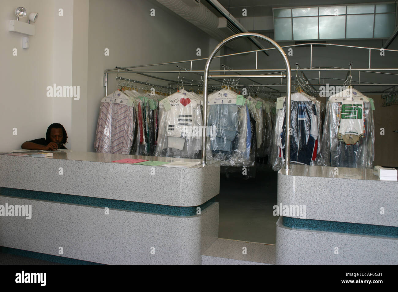 Man in dry cleaners hi-res stock photography and images - Alamy