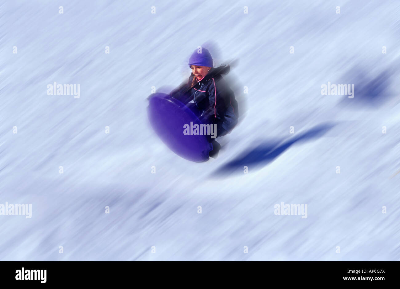 Girl sled down hill in hi-res stock photography and images - Alamy