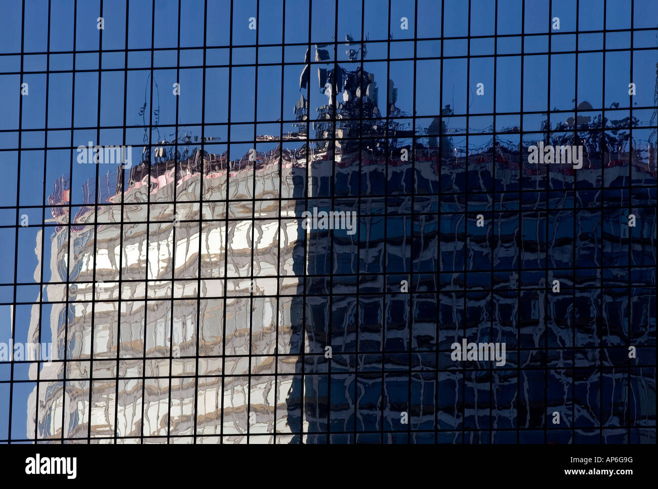 Reflection of Alpha Tower in the glass windows of the Hyatt Hotel in ...