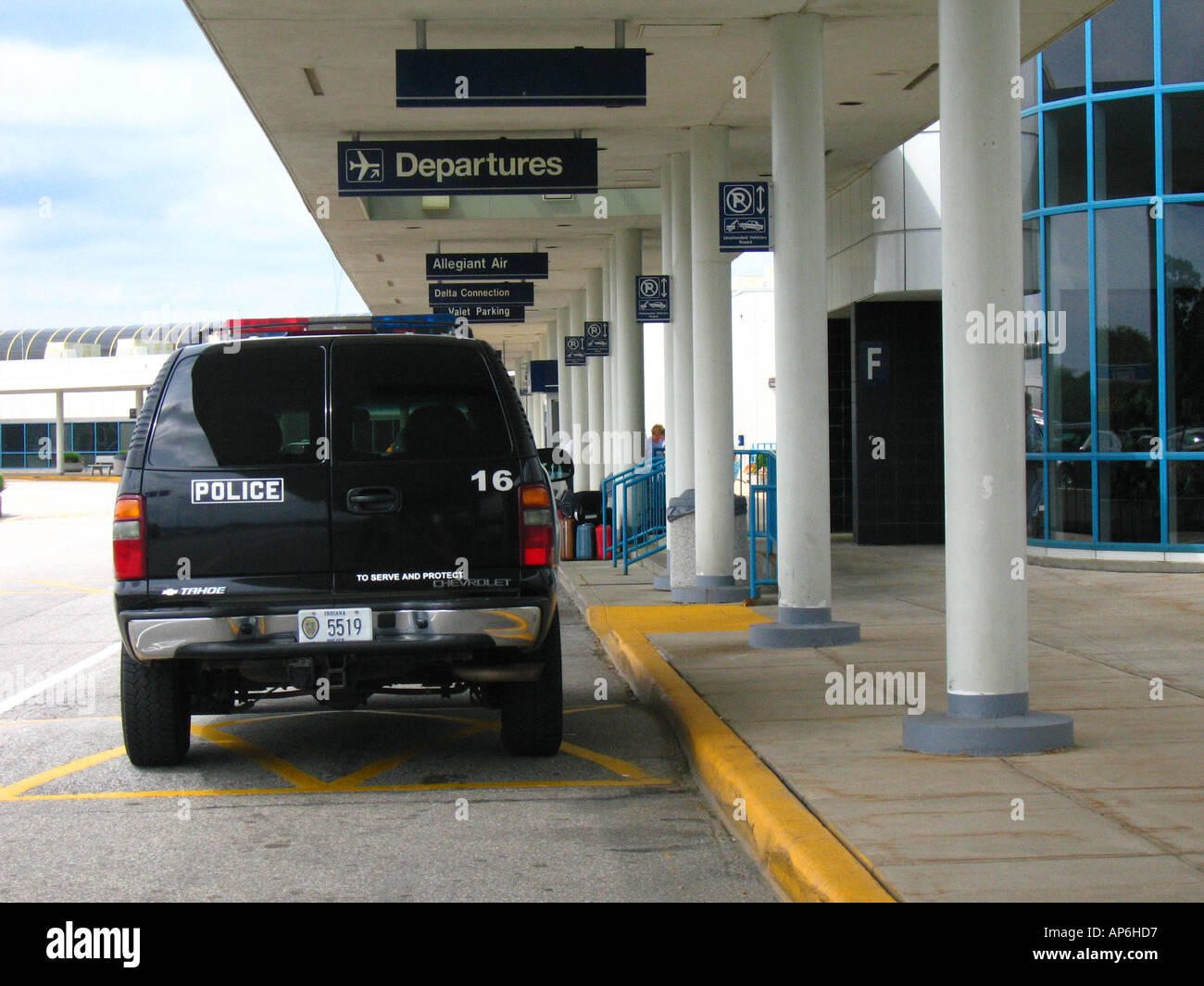 Police vehicle parked at the curbside of the departure area of the ...