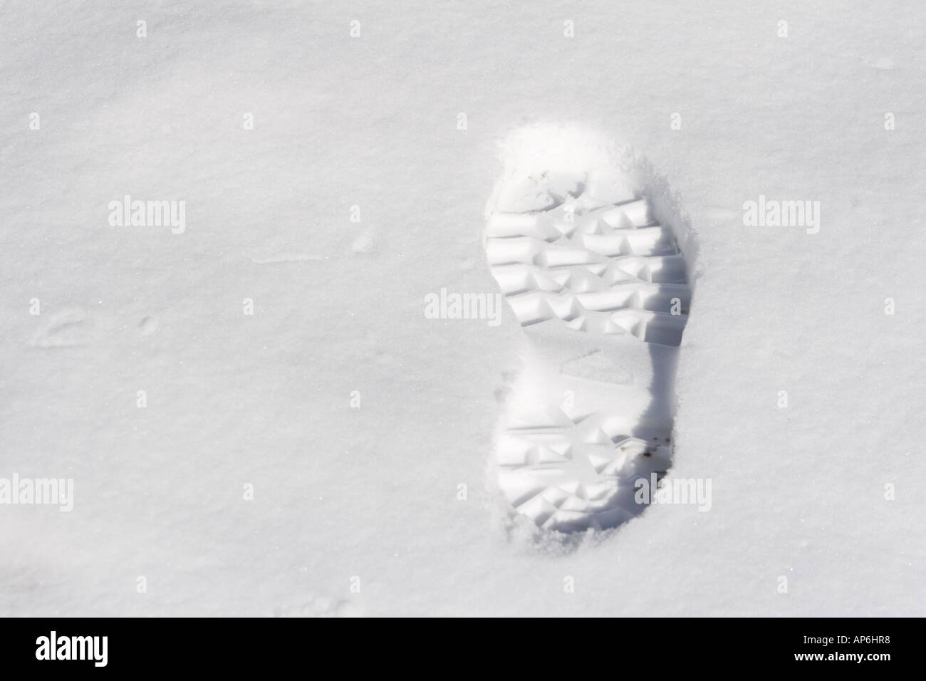 footprint of walking boot in snow Stock Photo - Alamy