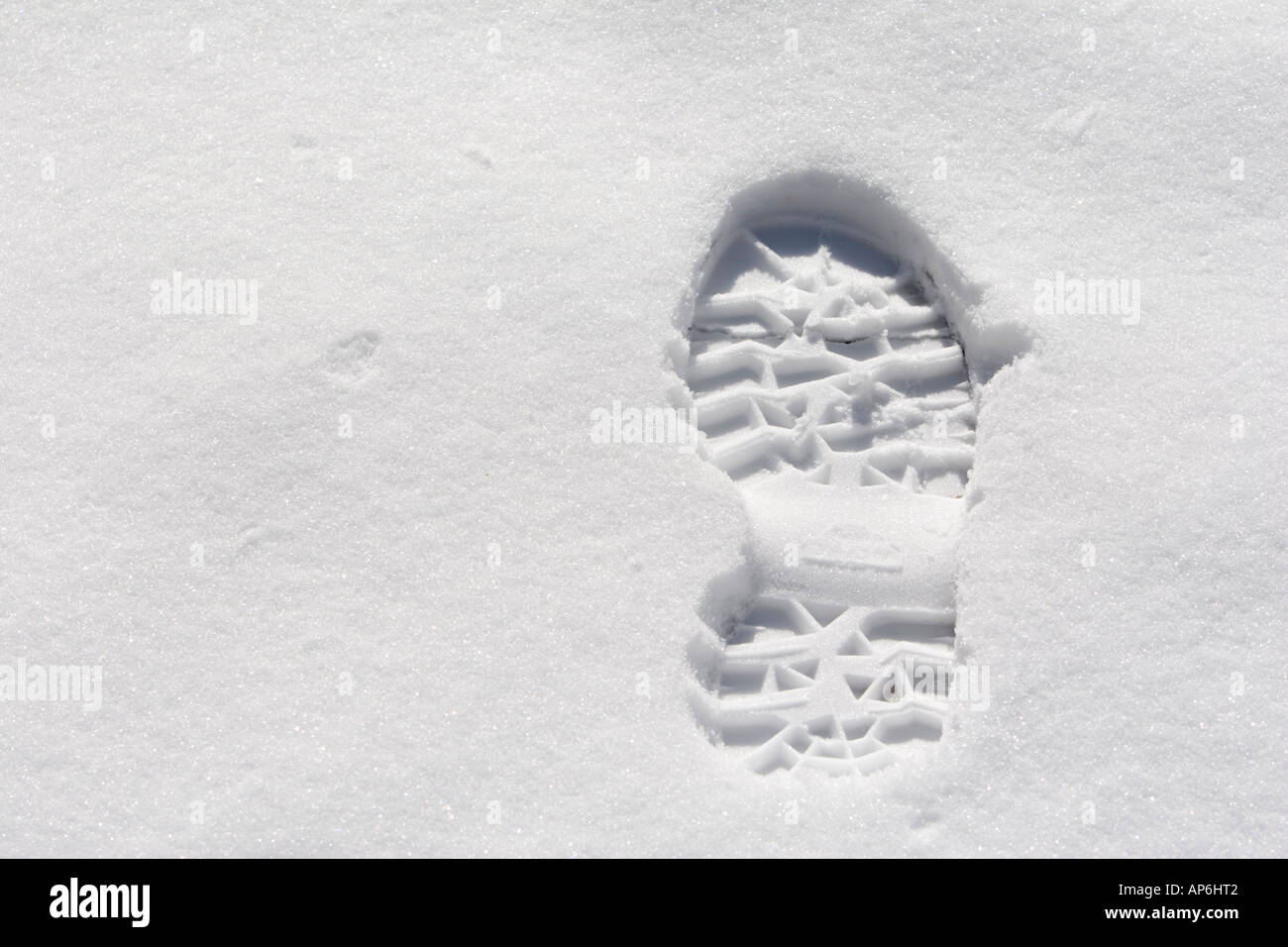 footprint of walking boot in snow Stock Photo - Alamy