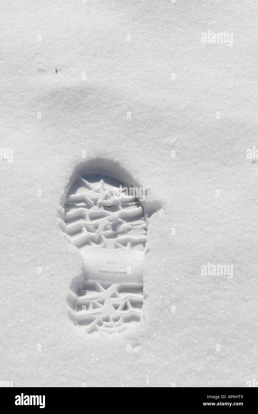 footprint of walking boot in snow Stock Photo - Alamy