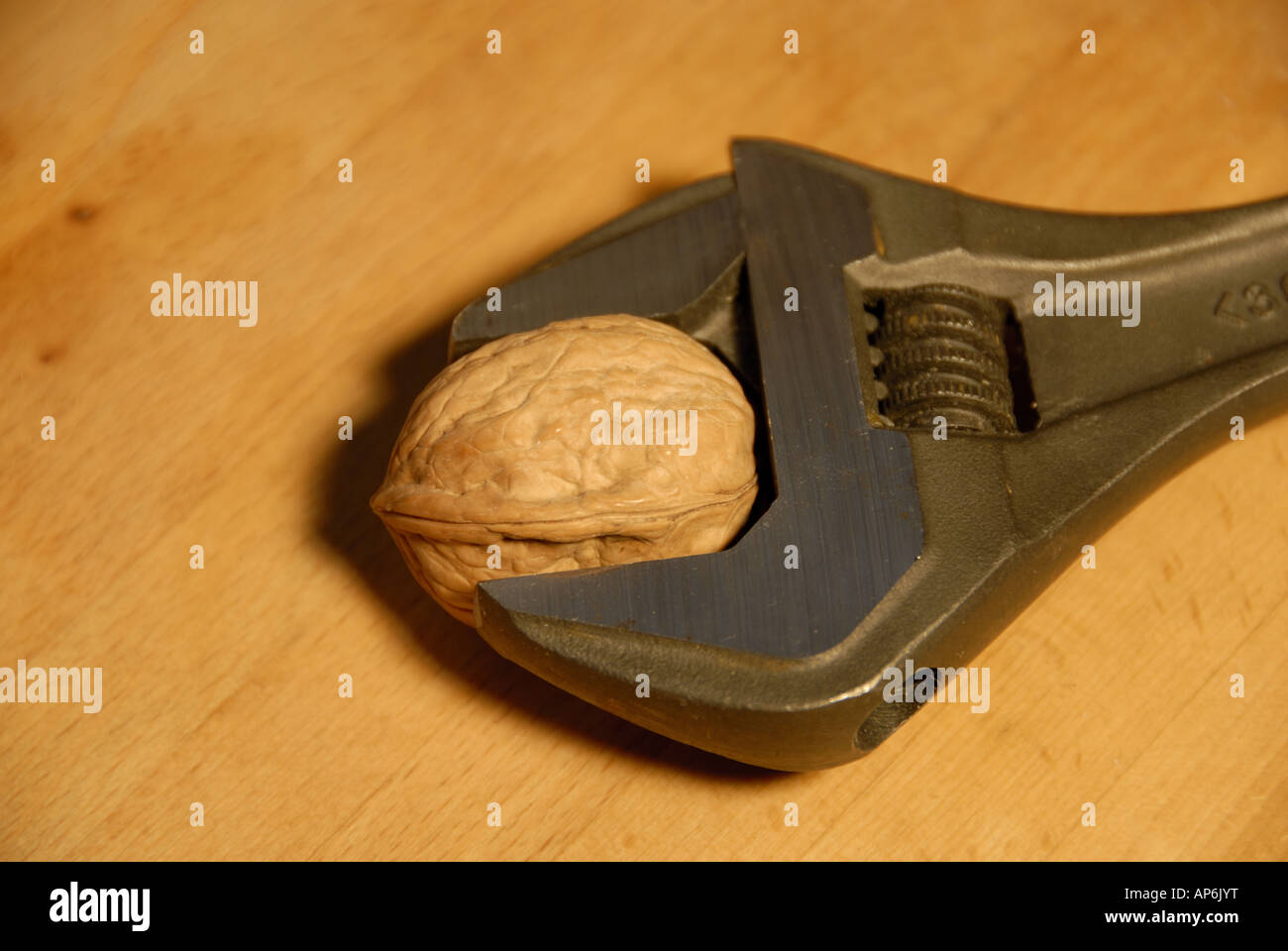 Nut and spanner – a visual pun Stock Photo - Alamy