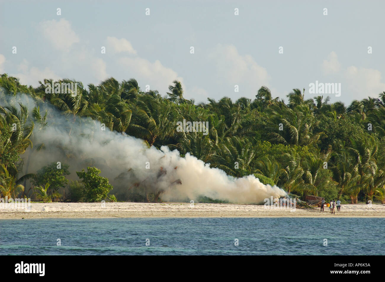 Air pollution in tropical paradise Post tsunami wreckage being burnt on ...