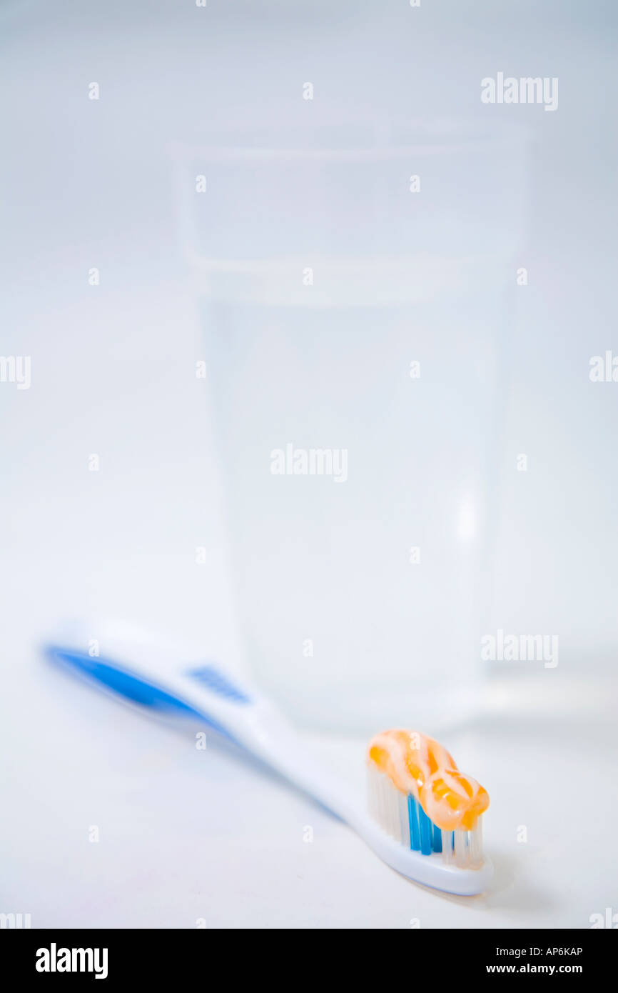 Toothbrush and cup of water Stock Photo - Alamy
