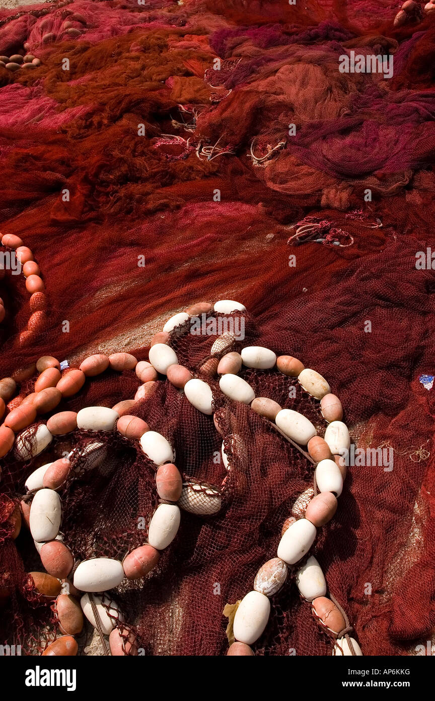 Red fishing net on the dock Stock Photo - Alamy