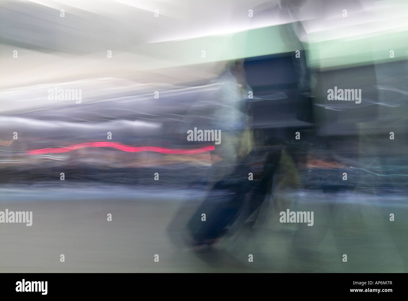 Man Rushing Fast Through Airport With Luggage Blur Stock Photo - Alamy
