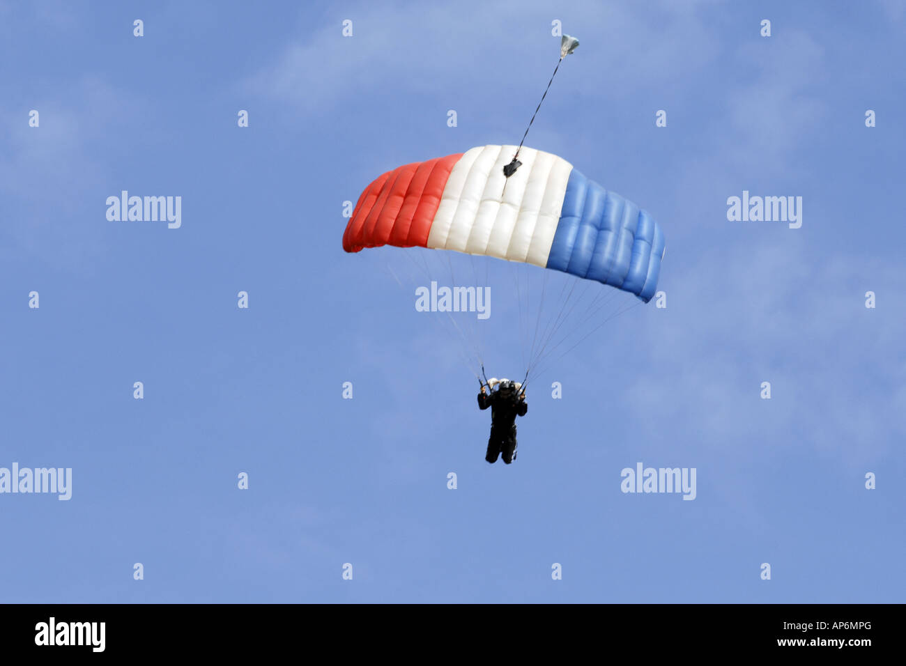 A Skydiver floats to earth using a new style rectangular parachute ...