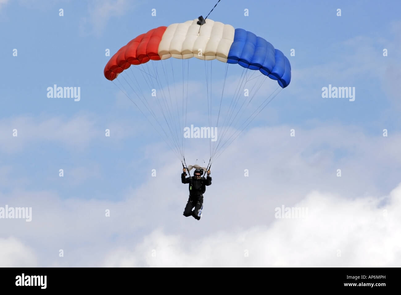 A Skydiver floats to earth using a new style rectangular parachute ...