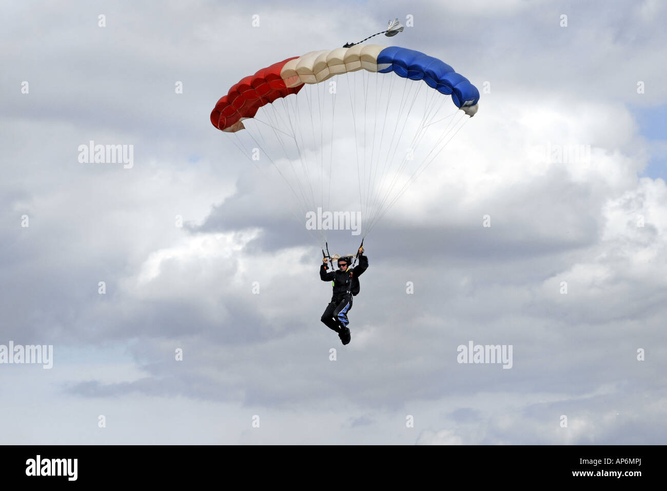 A Skydiver floats to earth using a new style rectangular parachute ...