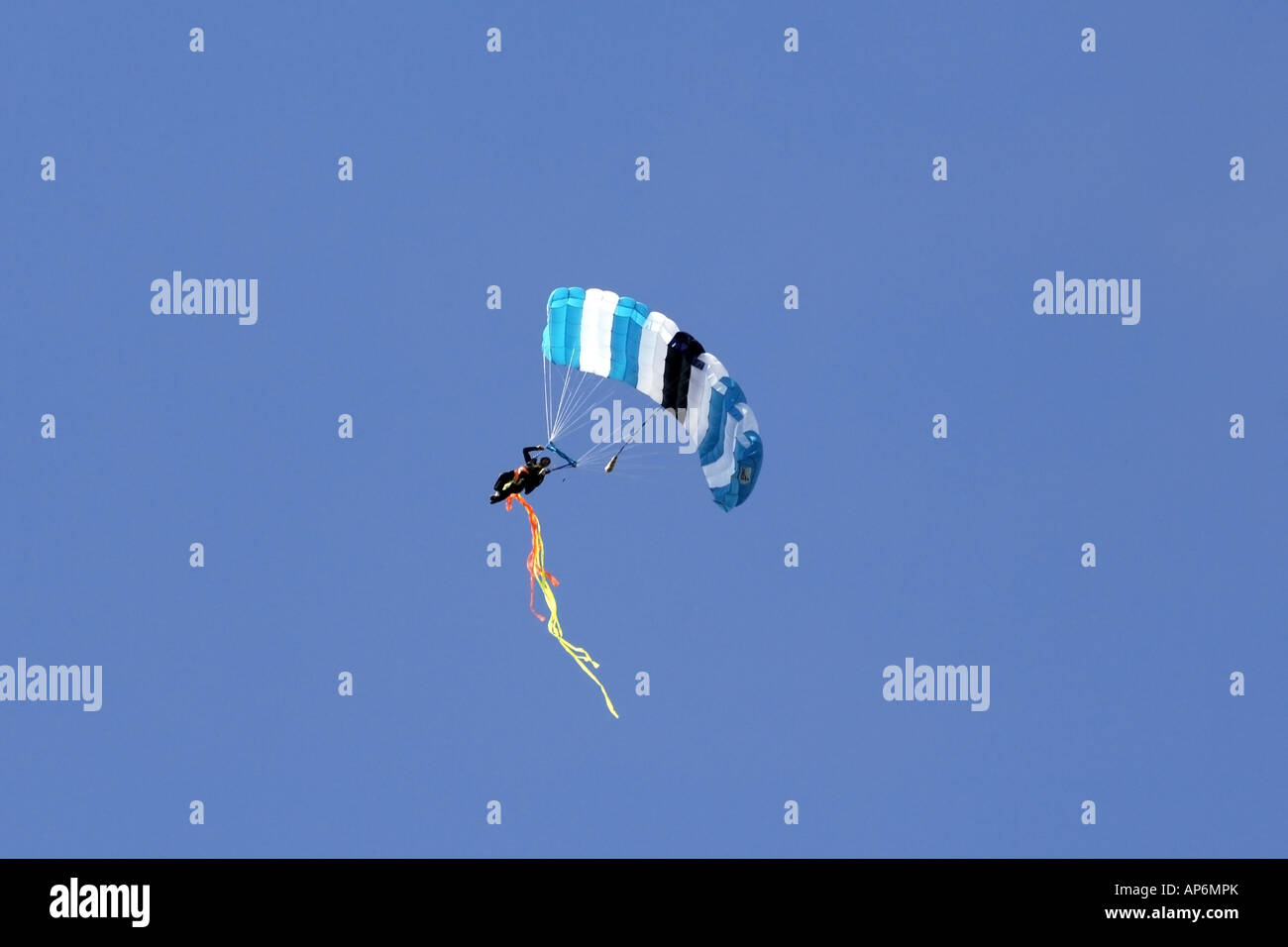 A Skydiver floats to earth using a new style rectangular parachute ...