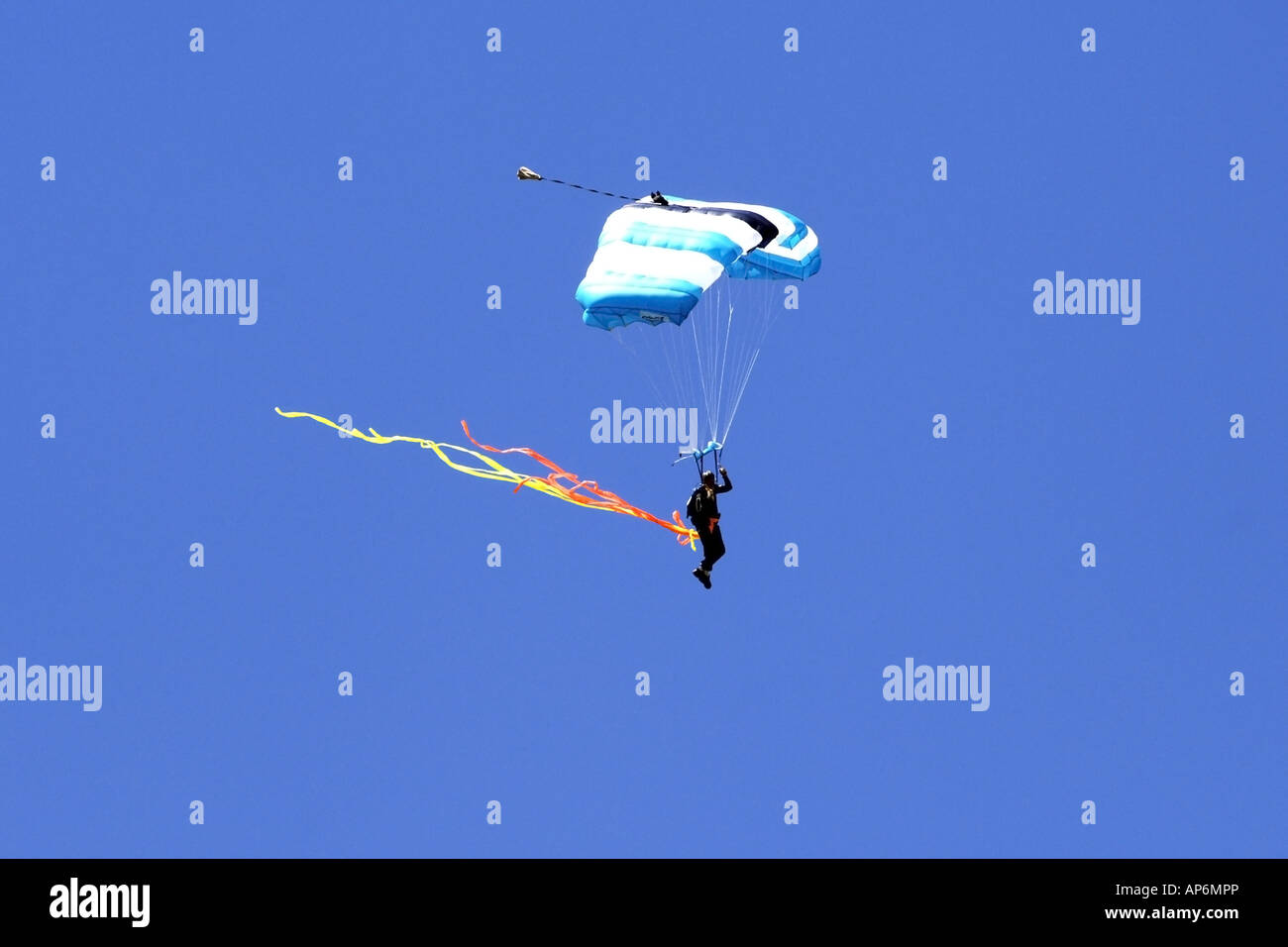 A Skydiver floats to earth using a new style rectangular parachute ...