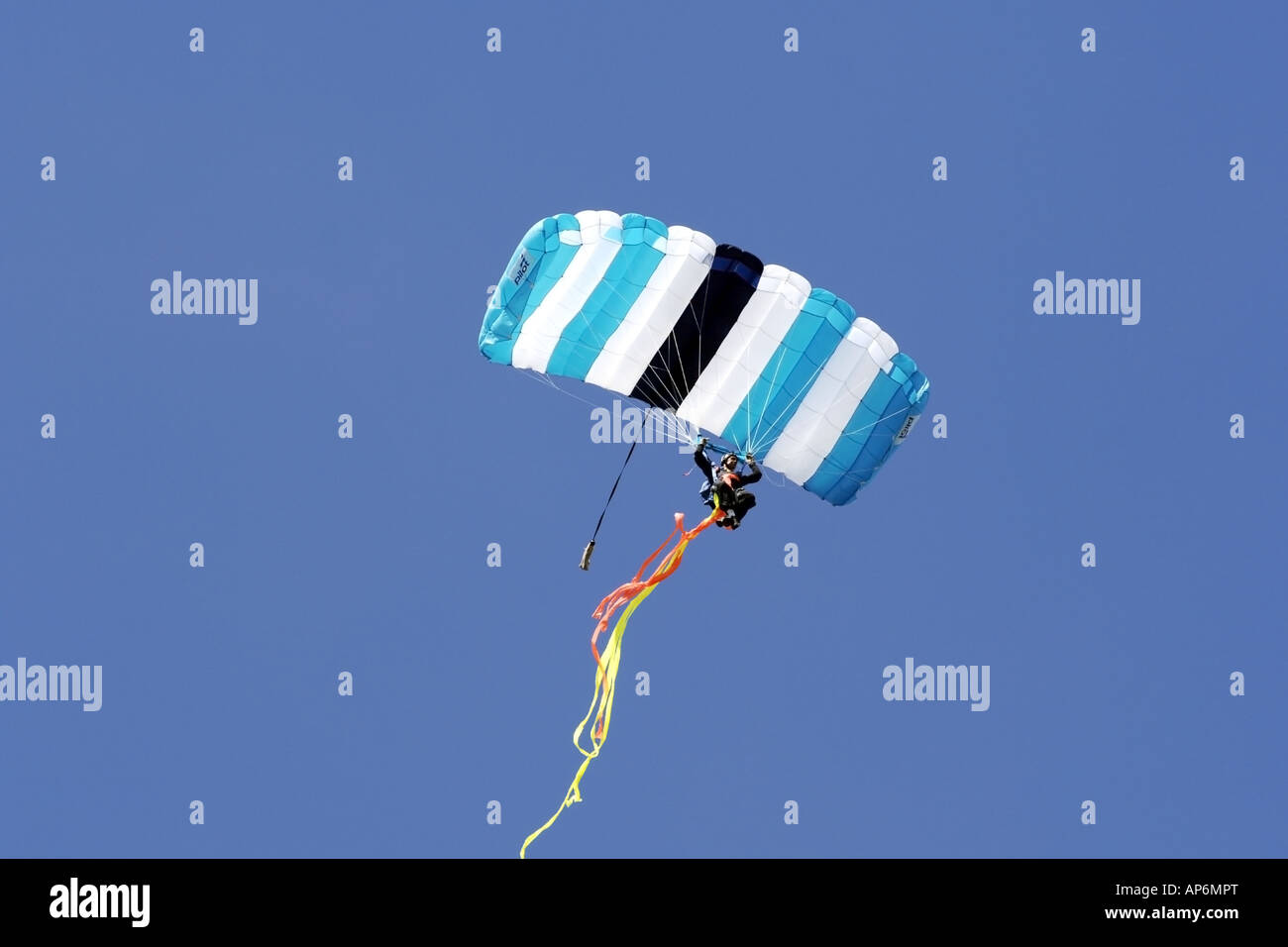 A Skydiver floats to earth using a new style rectangular parachute ...