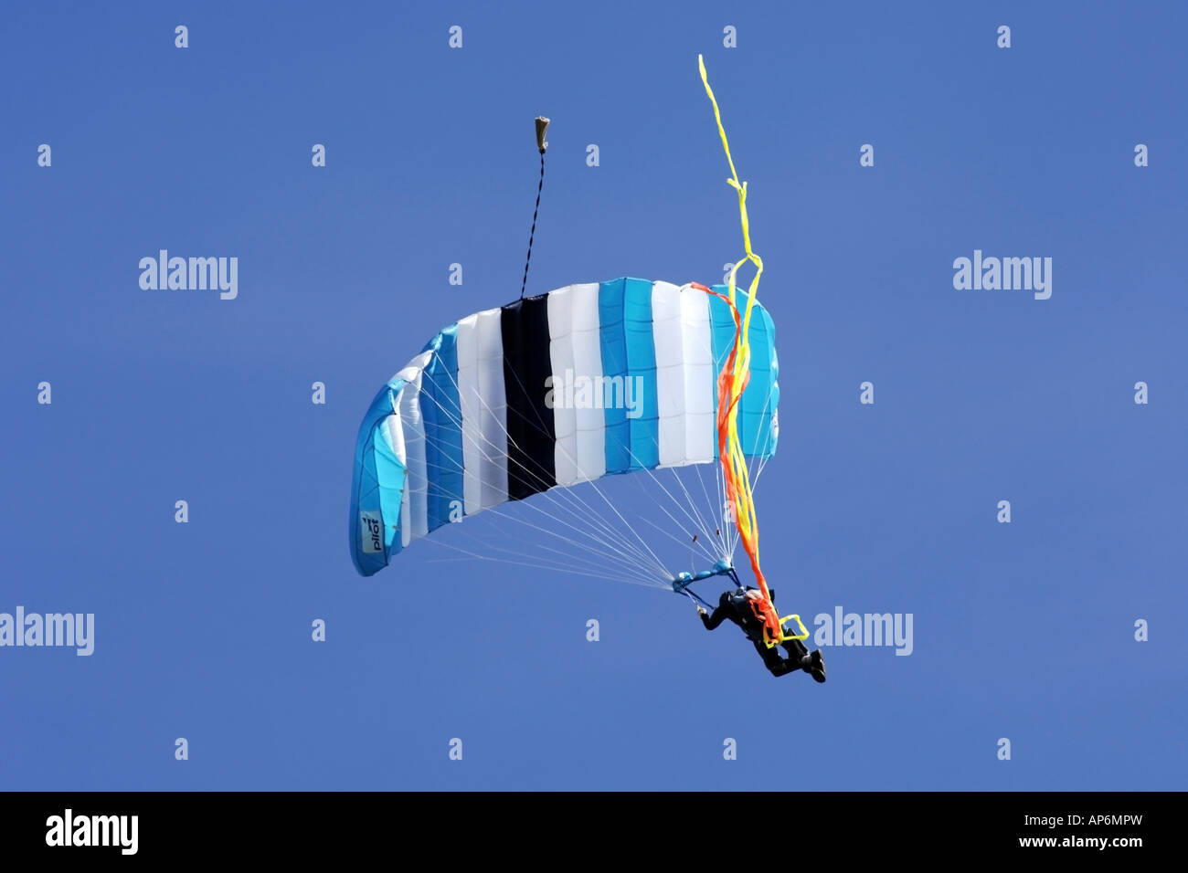 A Skydiver floats to earth using a new style rectangular parachute ...