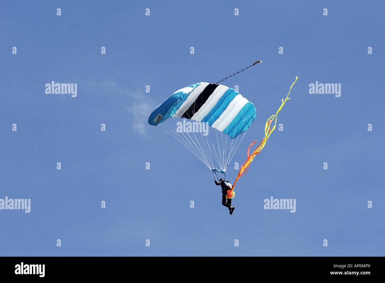 A Skydiver floats to earth using a new style rectangular parachute ...