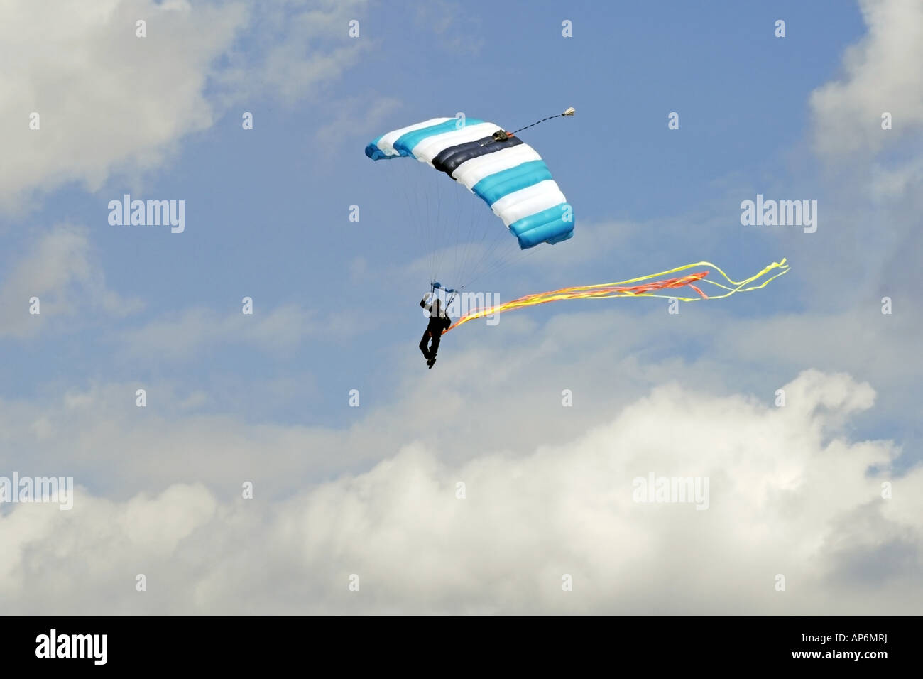 A Skydiver floats to earth using a new style rectangular parachute ...