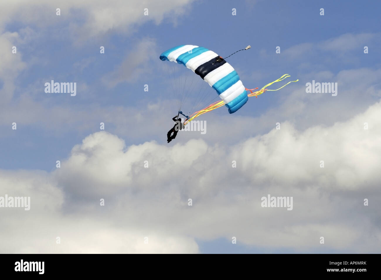 A Skydiver floats to earth using a new style rectangular parachute ...