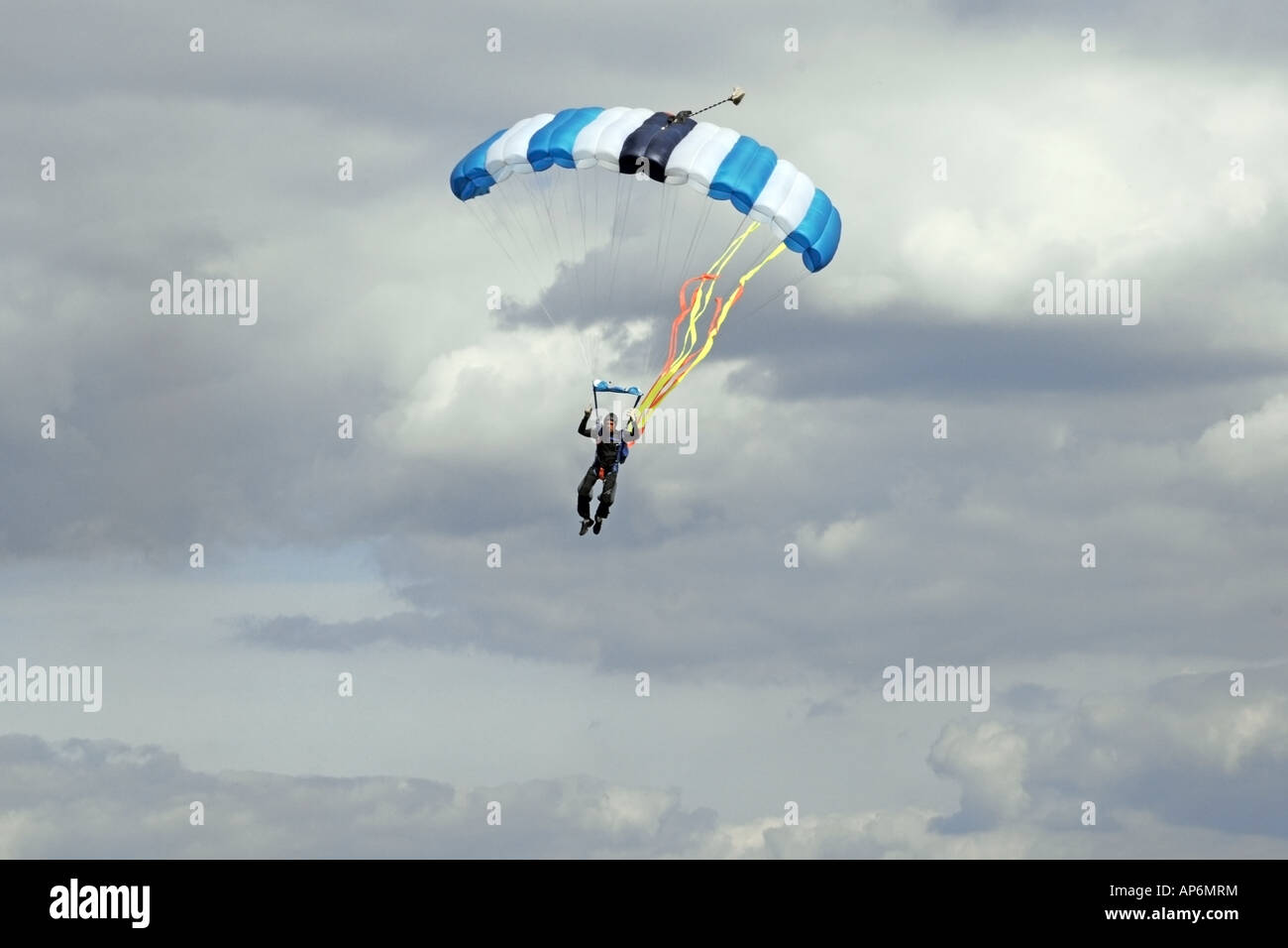 A Skydiver floats to earth using a new style rectangular parachute ...