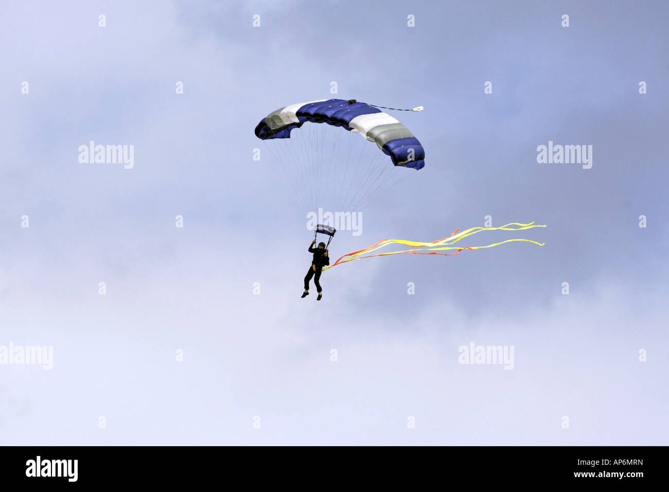 A Skydiver floats to earth using a new style rectangular parachute ...