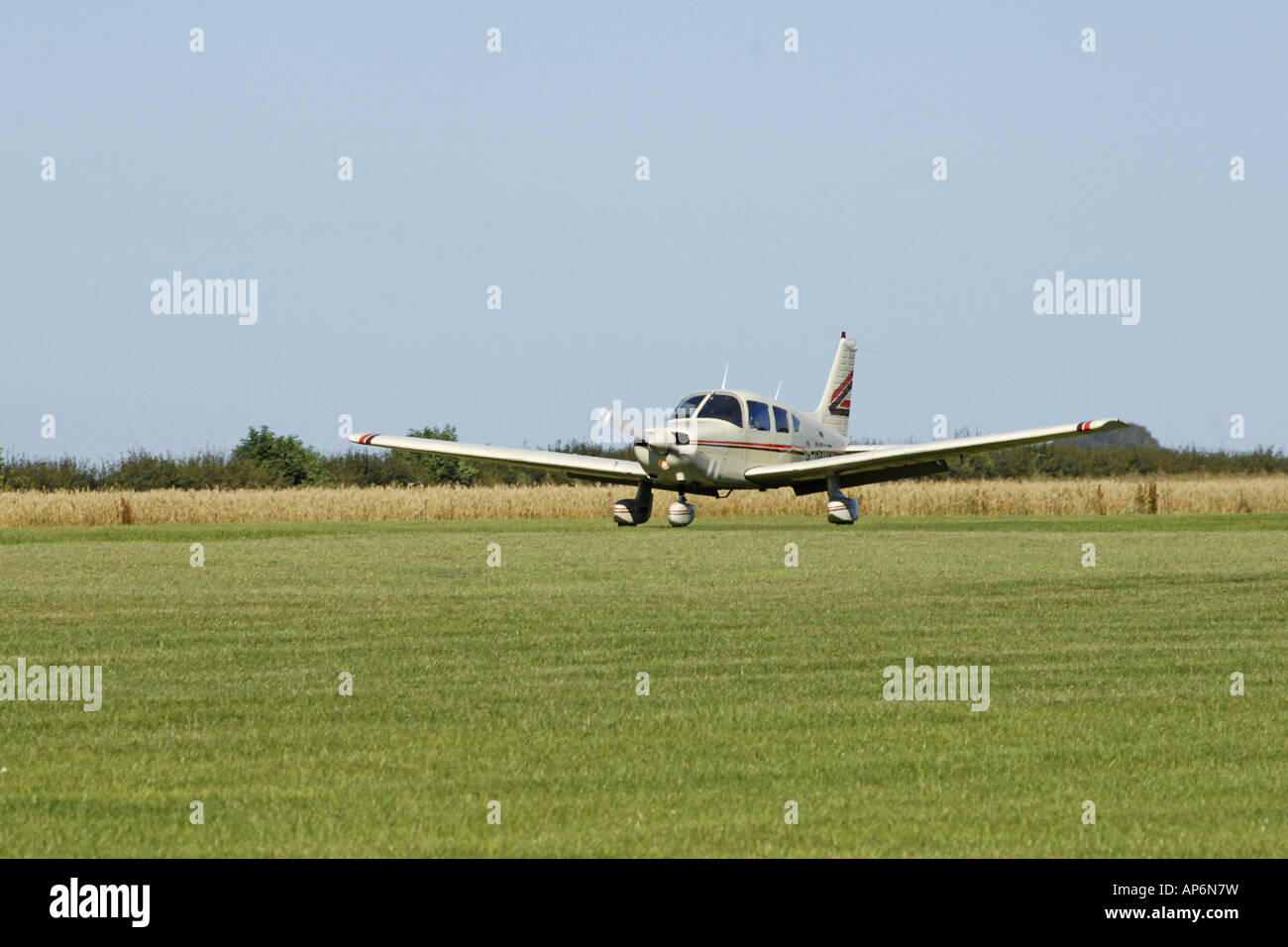 Piper Warrior II Light aircraft on a grass runway Stock Photo - Alamy