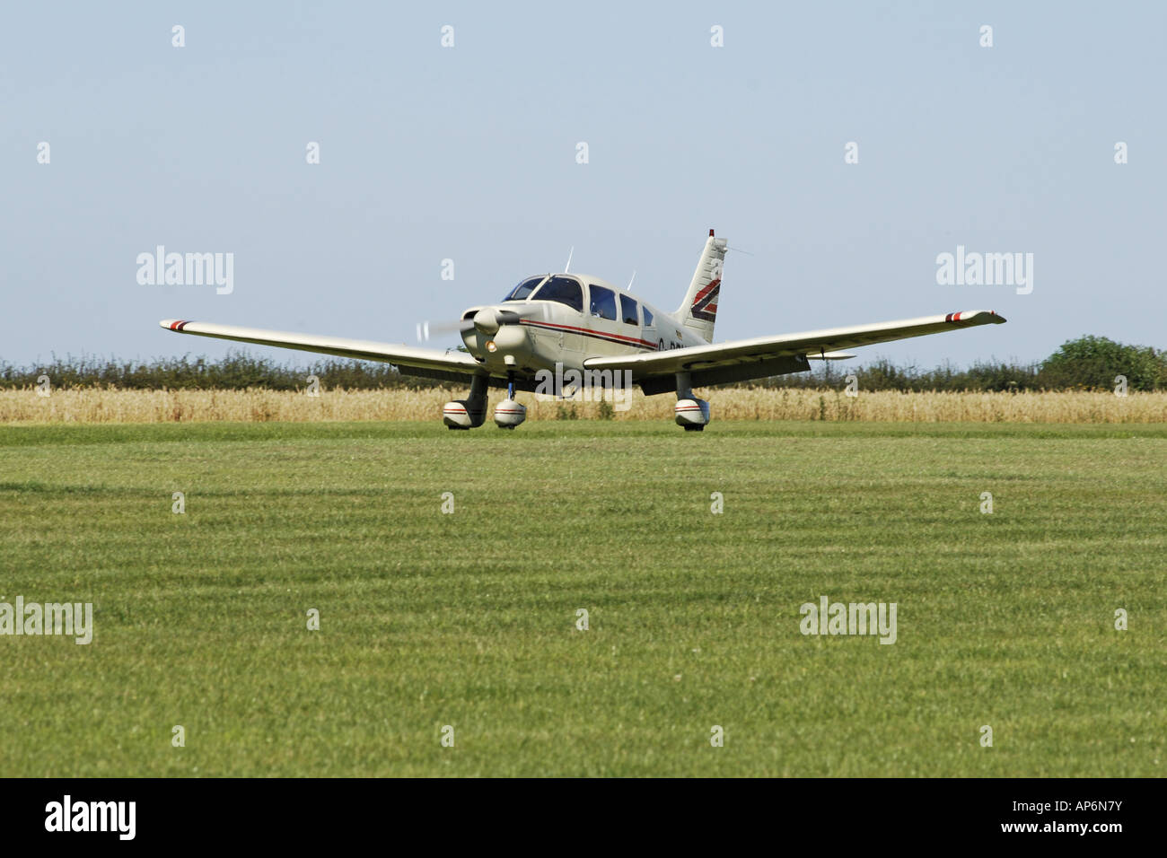 Piper Warrior II Light aircraft on a grass runway Stock Photo - Alamy