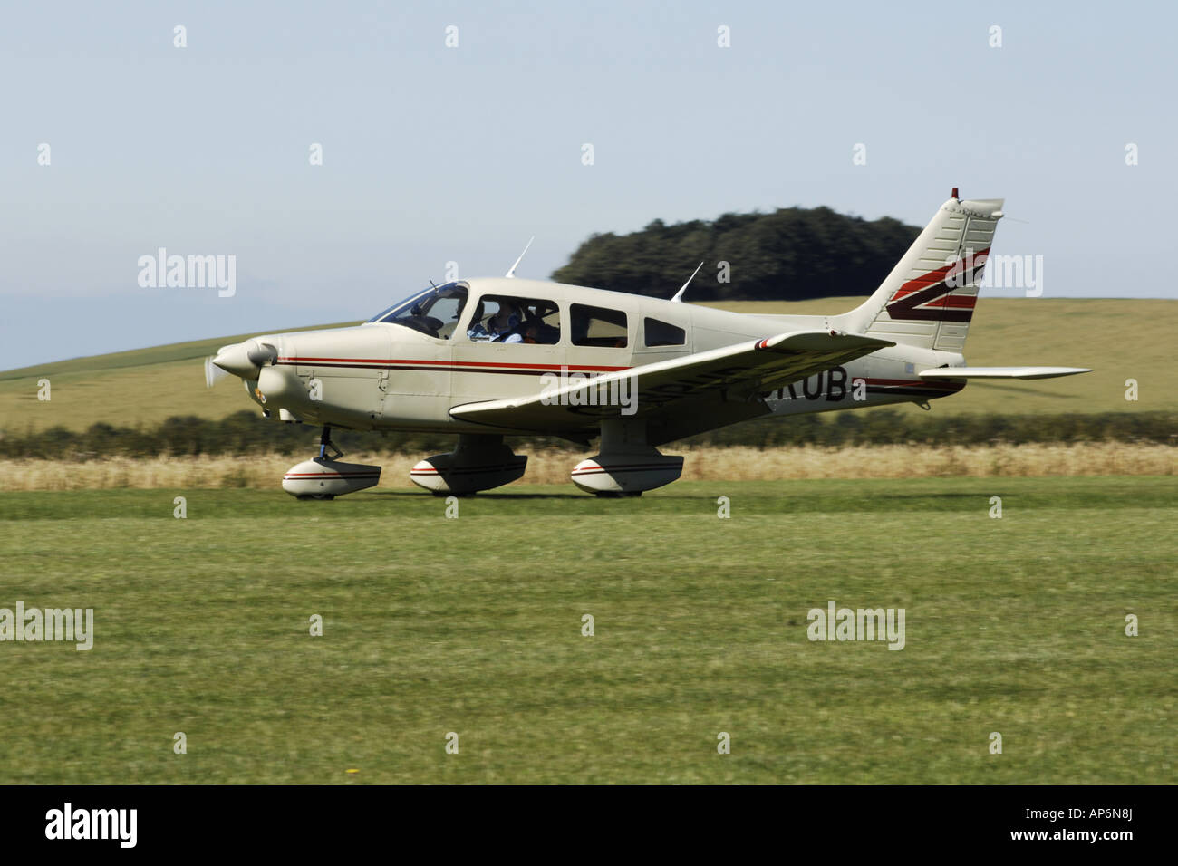 Piper Warrior II Light aircraft on a grass runway Stock Photo - Alamy