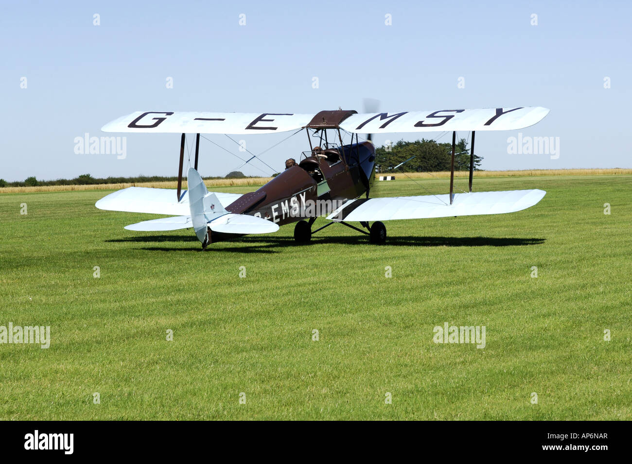 G EMSY 1930s De Havilland Gypsy Major aircraft taxiing down the grass ...