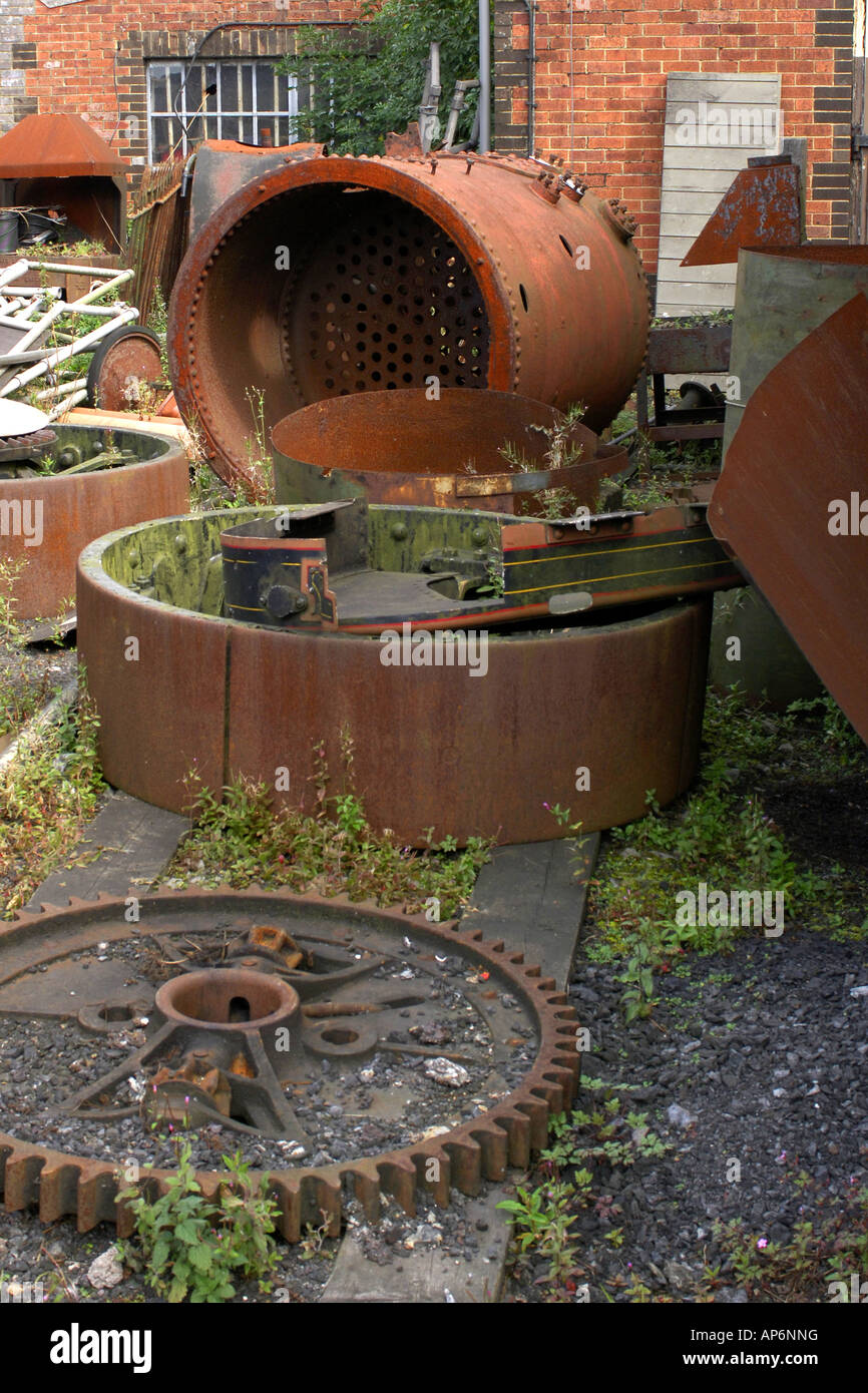 Rusting parts from old steam engines left outside to rot away at the ...