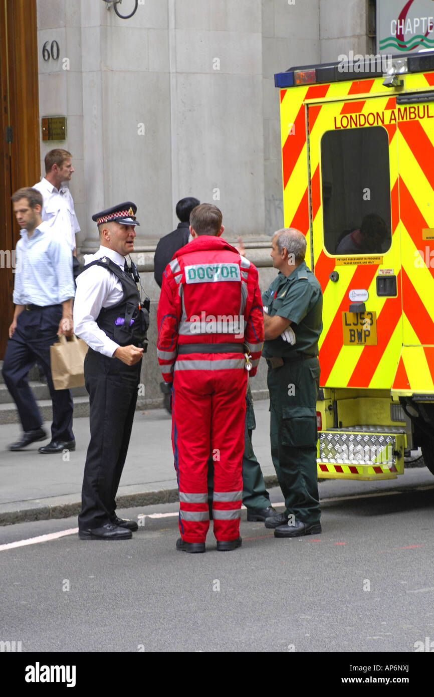 A Policeman Rapid Response doctor and paramedics discuss an emergency ...