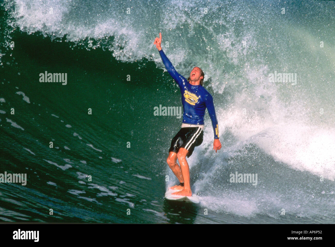 Surfers in shorts hi-res stock photography and images - Alamy
