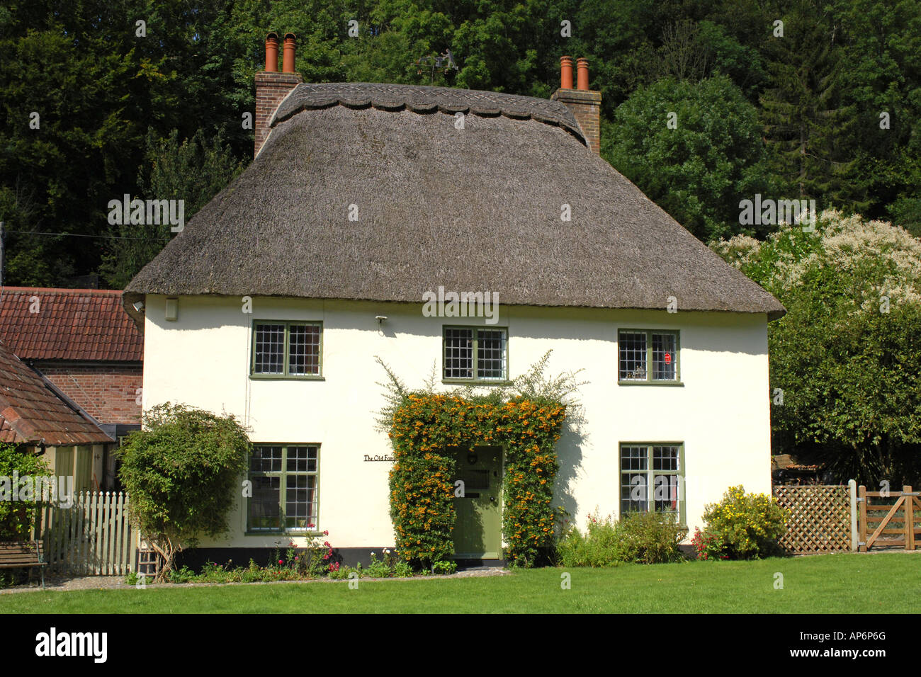 The picturesque thatched roof cottage in Milton Abbas Dorset Built in ...