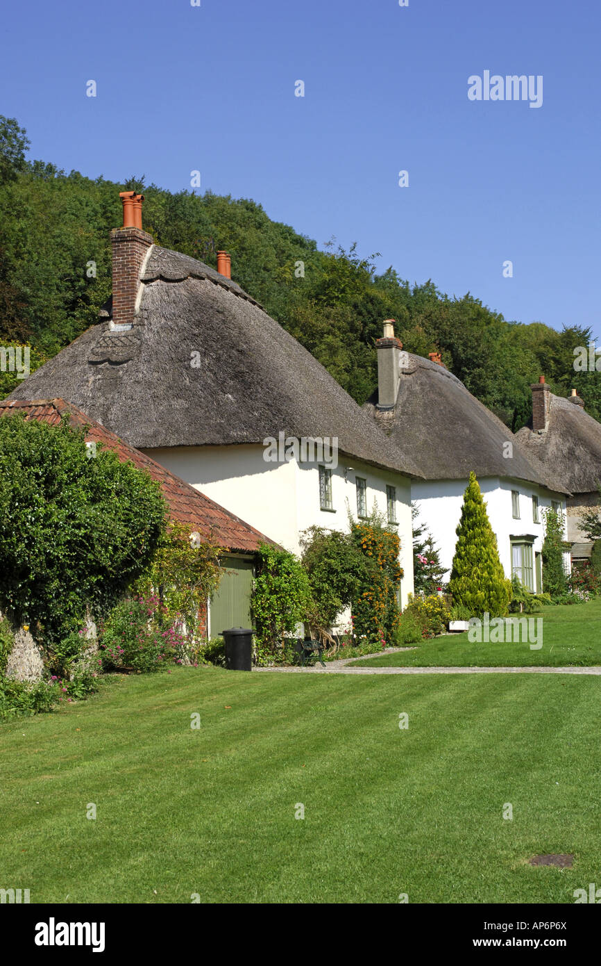 The picturesque thatched roof cottages of Milton Abbas Village Dorset ...