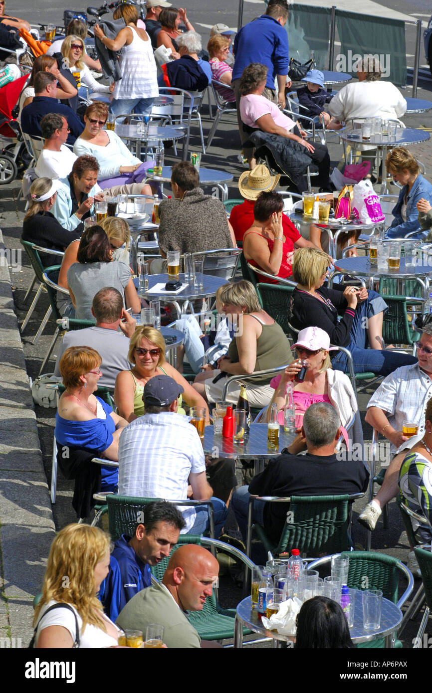 Crowds of people enjoy the local food and drink at a large alfresco ...