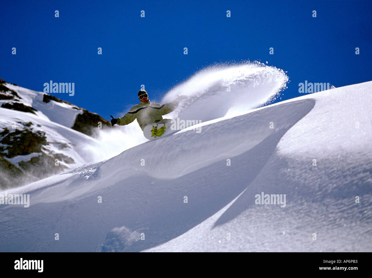 Men snowboarding down mountain hi-res stock photography and images - Alamy