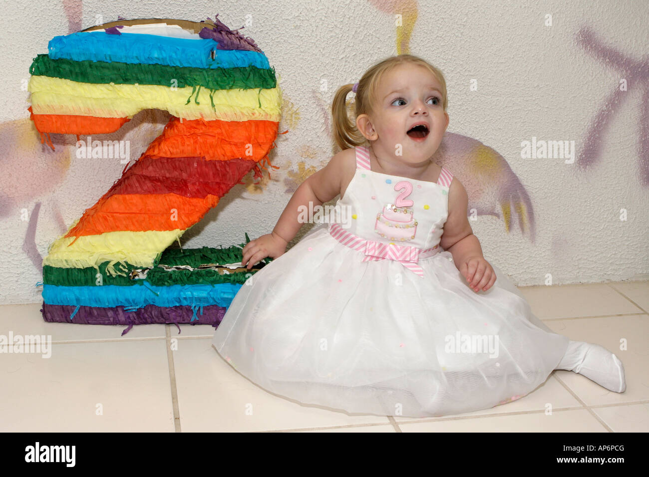 Blond Female Child Toddler Model with Large Number 2 Stock Photo - Alamy