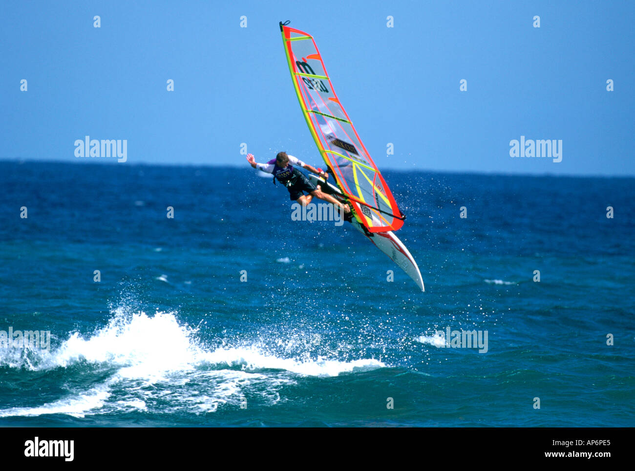 Windsurfer jumping waves, Hawaii Stock Photo - Alamy