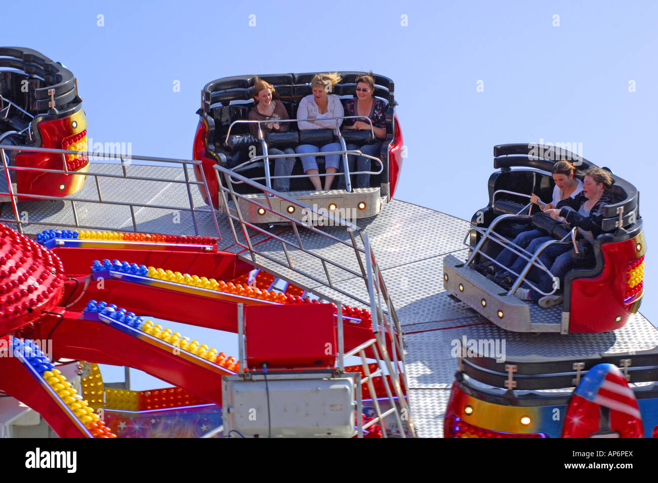People having fun on a fairground ride Stock Photo - Alamy