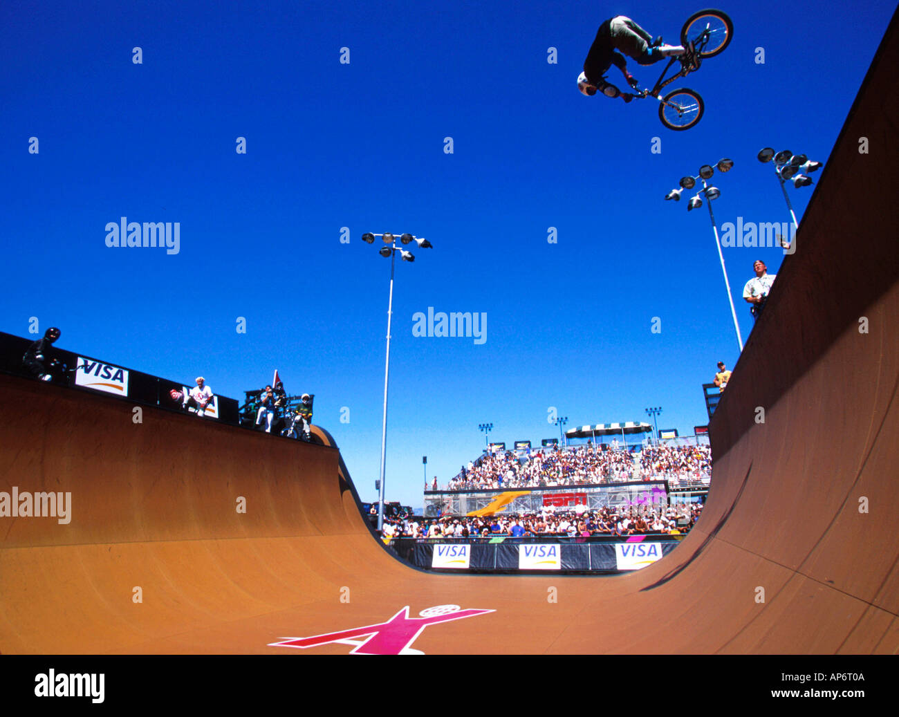 BMX Action on skate ramp with spectators Stock Photo - Alamy